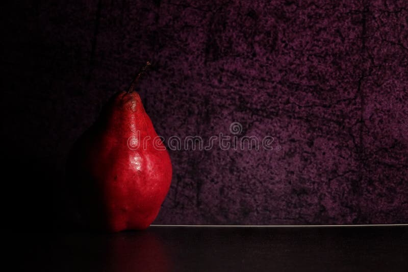 Williams Red Pear in Lowlight Stock Photo - Image of fruit, fruits ...
