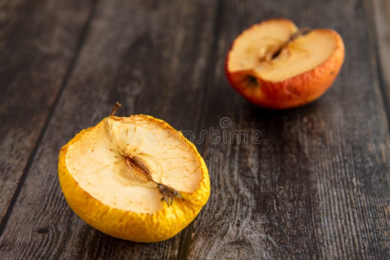 Wilted Rotten Half Apples on a Wooden Surface Stock Image - Image of ...
