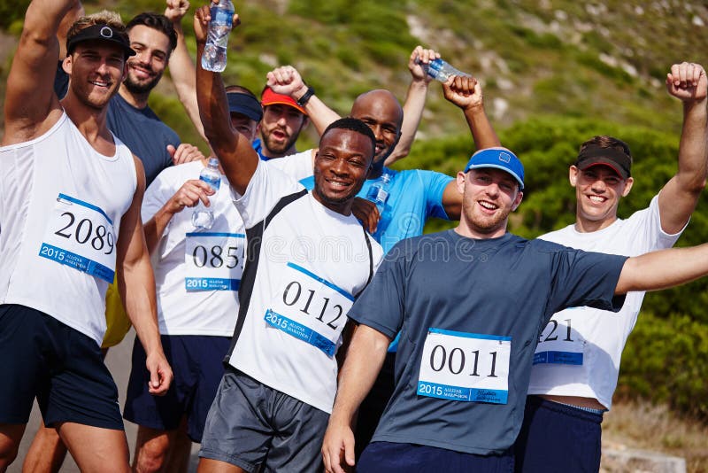 For the Win. a Group of Young Men Standing Together with Their Water ...