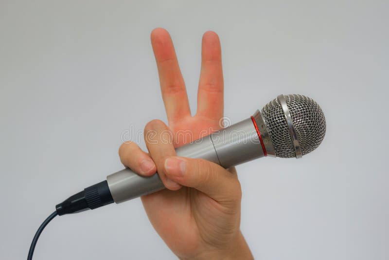 Hand and microphone stock image. Image of metal, hand - 29191377