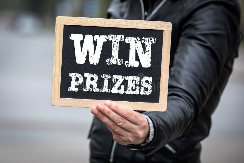 WIN PRIZES Concept. Text on Chalk Board. Woman in Jacket Stock Image ...