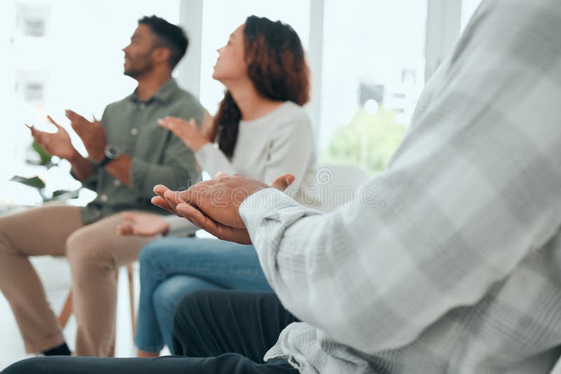 We Win Together. an Unrecognisable Group of People Sitting Together and ...