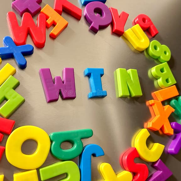 Win Written in Colourful Magnetic Letters Stock Image - Image of ...