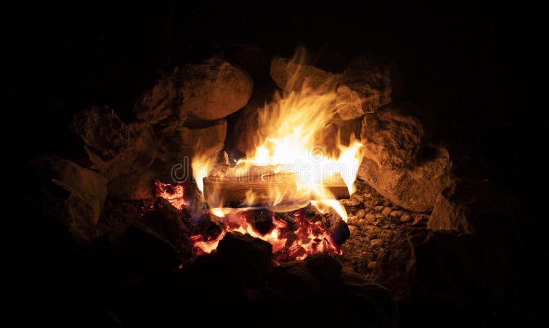 Wind blown campfire stock image. Image of flames, embers - 270148659