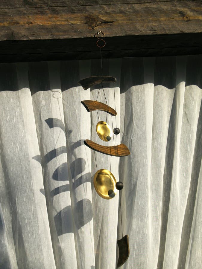 Wind chime beside building stock photo. Image of exterior - 5098262