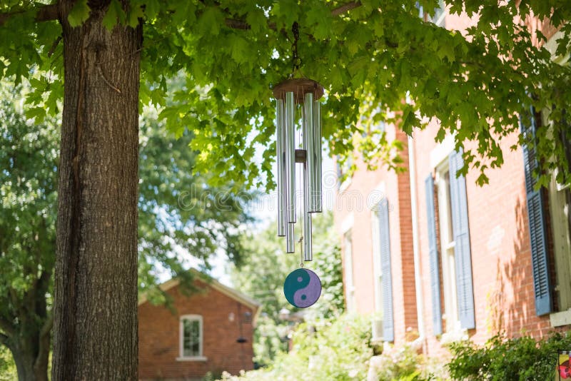 Wind Chime on a Tree in a Backyard Stock Image - Image of decoration ...