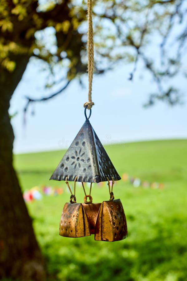 Wind chimes on a tree stock photo. Image of metal, woodland - 378032908