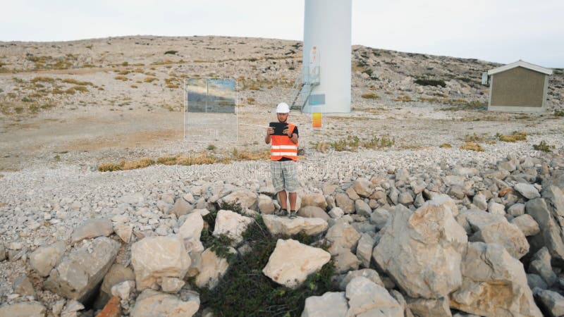 Wind Energy Engineer Testing the Function of Windmill through His ...
