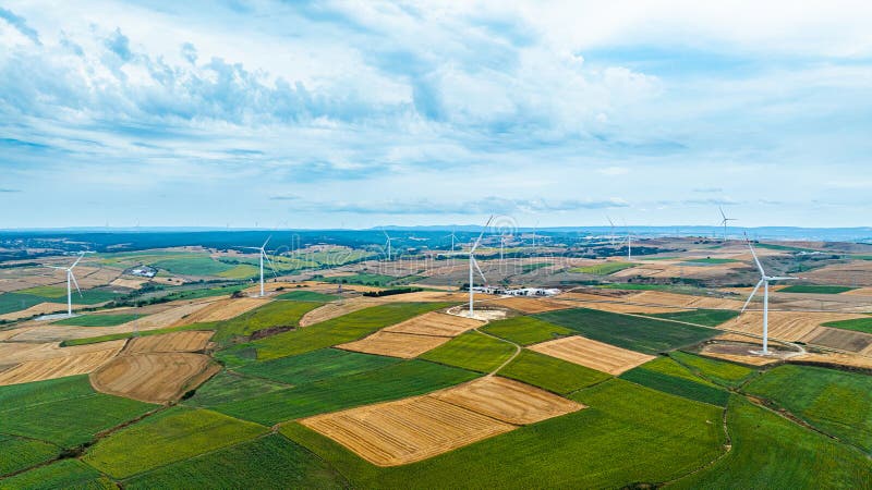 Aerial View of Wind Energy Turbines Located in Fertile Agricultural ...