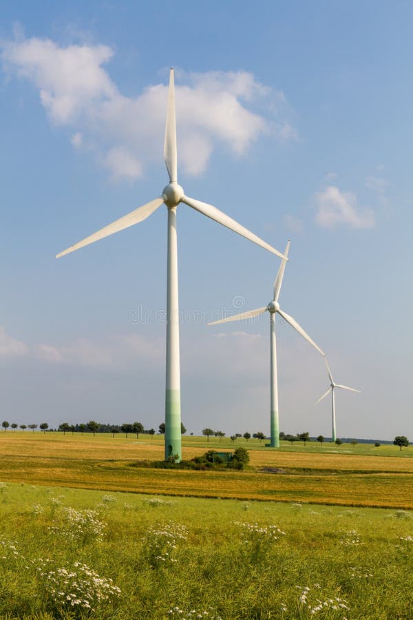 3Wind Engines with Wild Meadow Stock Photo - Image of power ...