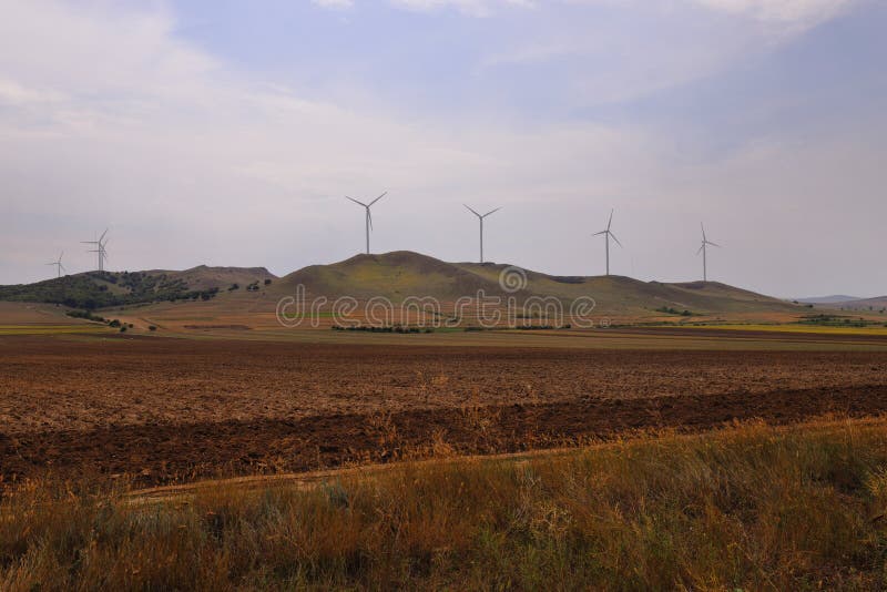 Wind Farm at the MÄƒcin Mountains in Romania Stock Image - Image of ...