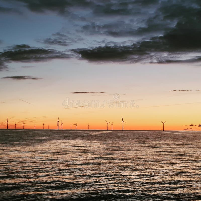 Wind Farm Sunrise stock photo. Image of sunrise, dusk - 257016934