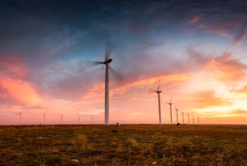Wind farm at sunrise stock image. Image of vertical - 120964647