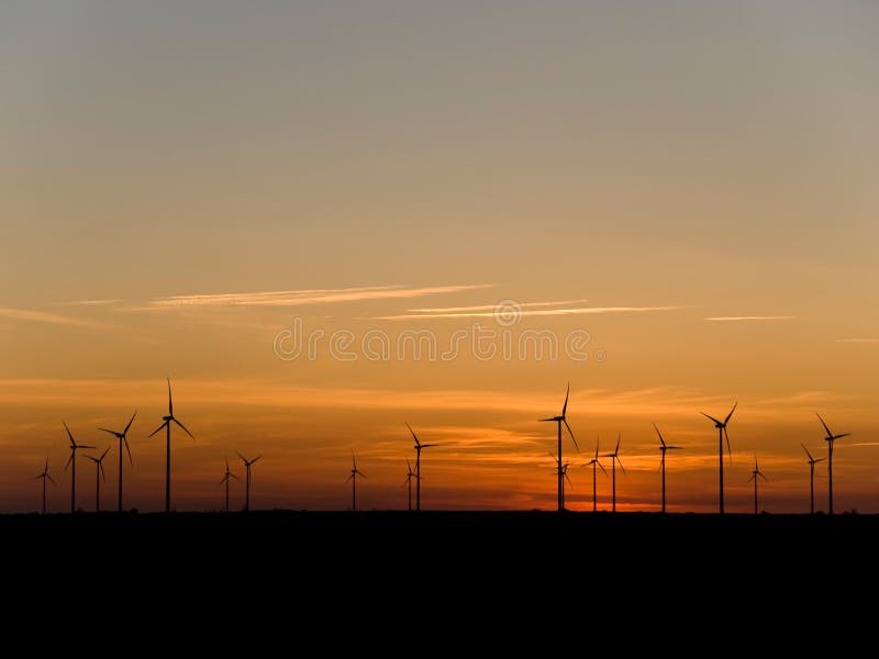 Wind farm at sunset stock image. Image of environmental - 13637557
