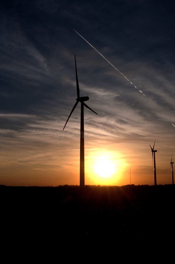 Wind farm at sunset stock image. Image of outdoors, voltage - 17040321