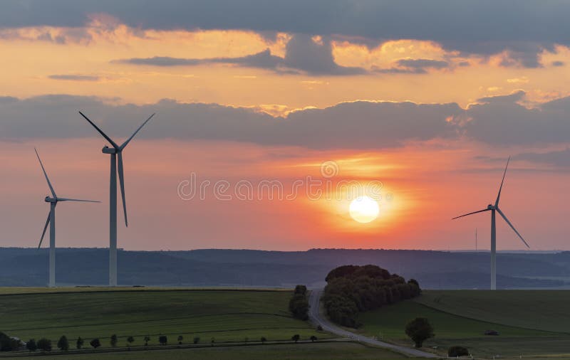 Wind farm in the sunset stock photo. Image of nature - 194160492