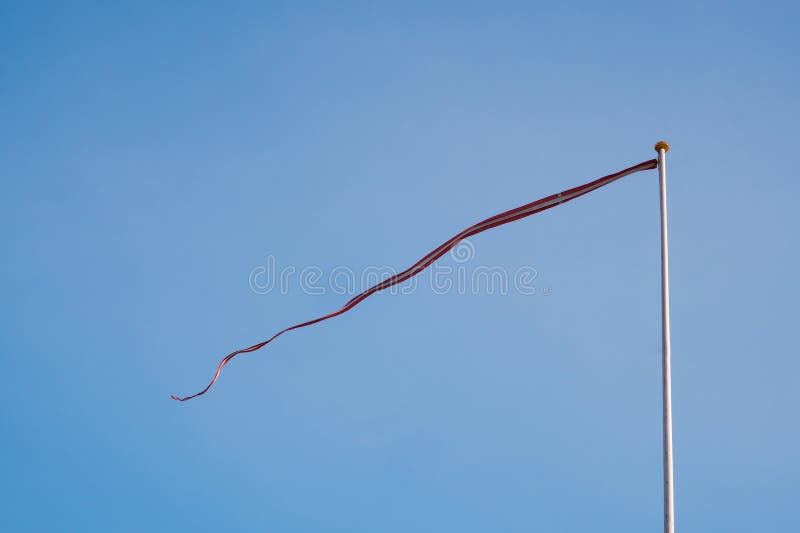 Wind Flag Flying in the Wind on Blue Sky. Flag Under Blue Sky Stock ...