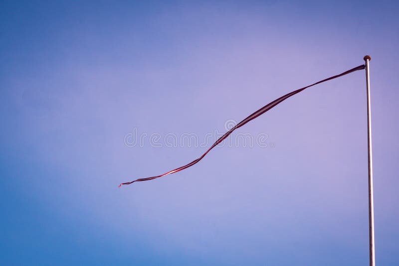 Wind Flag Flying in the Wind on Blue Sky. Flag Under Blue Sky Stock ...