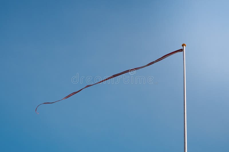 Wind Flag Flying in the Wind on Blue Sky. Flag Under Blue Sky Stock ...