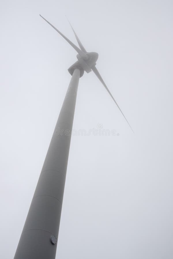 Wind generator in the fog stock photo. Image of alternative - 333997242