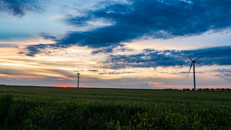 Wind Generator in Grass Field at Sunset Stock Image - Image of global ...