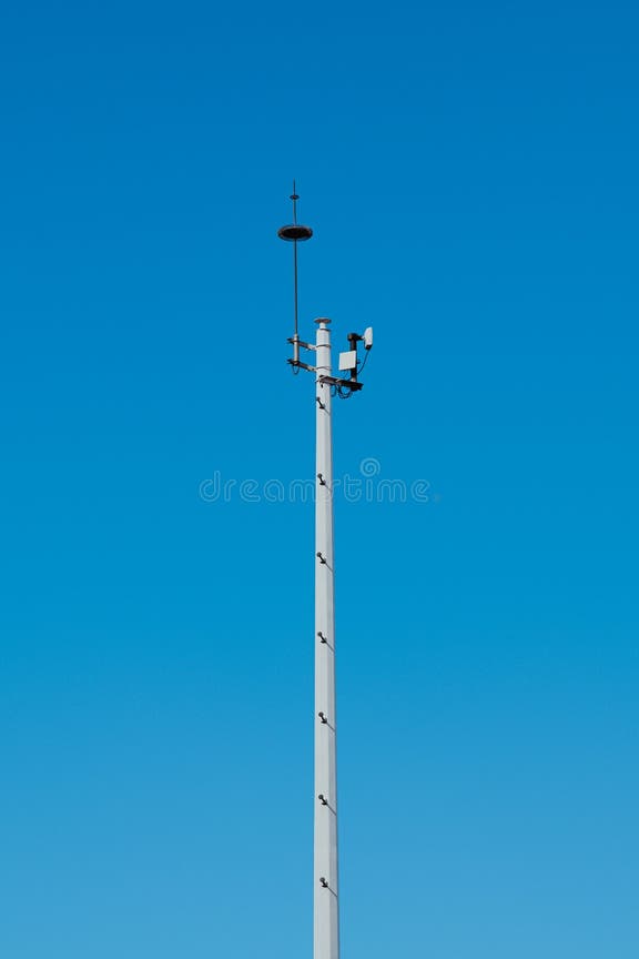 Wind Indicator on Top of a Light Pole. Stock Image - Image of ...