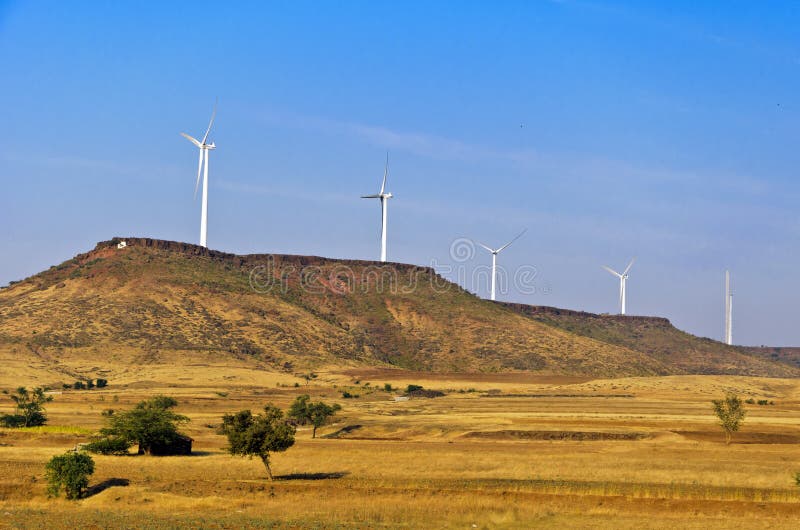 Wind Mills on the Hills, Wind mills atop a hill, in arid land of the ...
