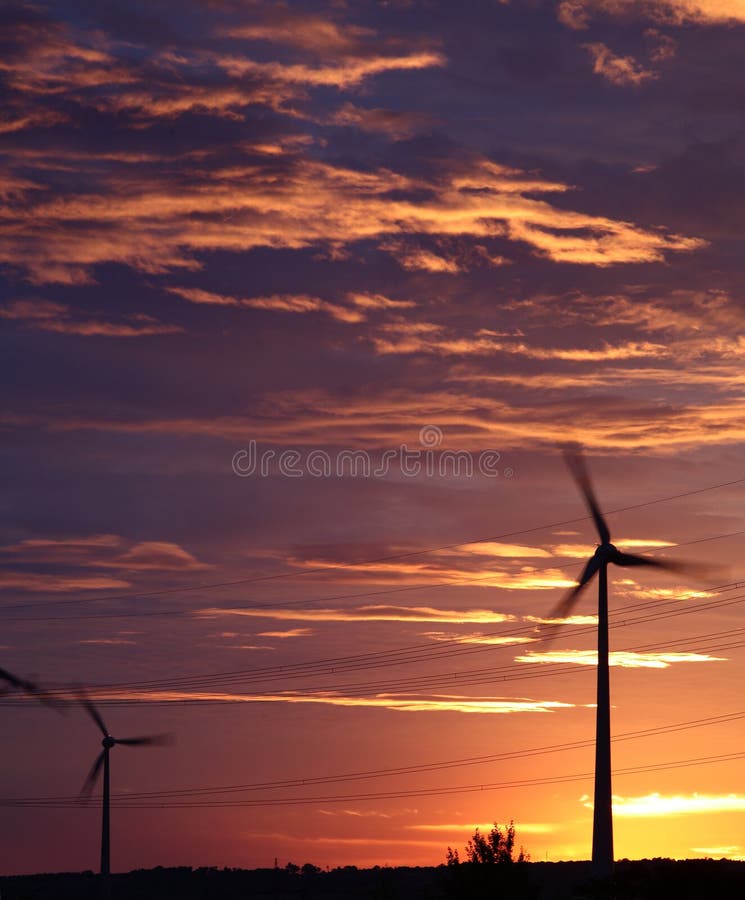 Wind mills at sunrise stock photo. Image of power, environment - 12214012
