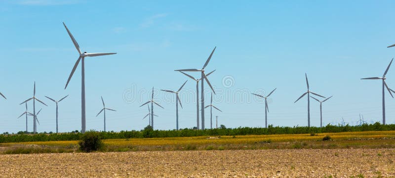 Wind power plants on field stock image. Image of area - 274021829