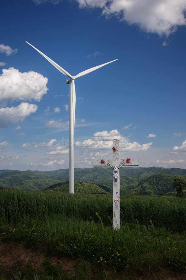 Wind Power Station and Cross Stock Image - Image of flowers, meadows ...