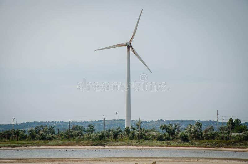 A Wind-powered Generator at the Base of the Greener Stock Photo - Image ...