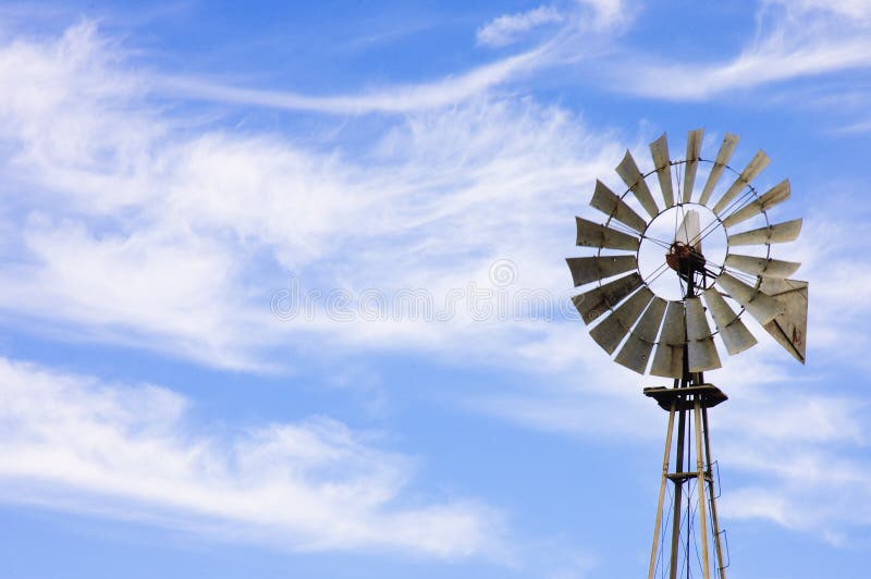 Wind powered water pump stock image. Image of blue, power - 15176437