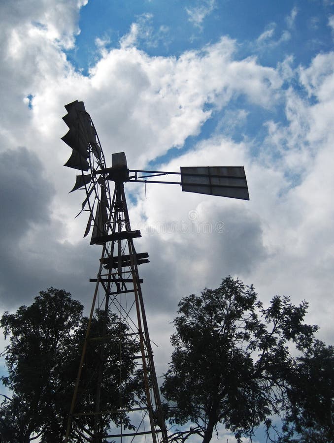 Wind Pump Against Blue Sky with Large Clouds Stock Photo - Image of ...