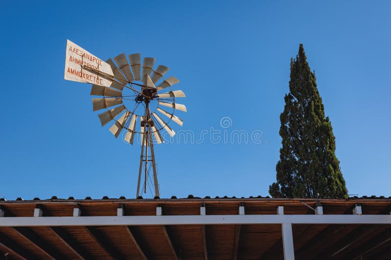 Wind pump in Cyprus editorial photography. Image of anatolian - 275434797