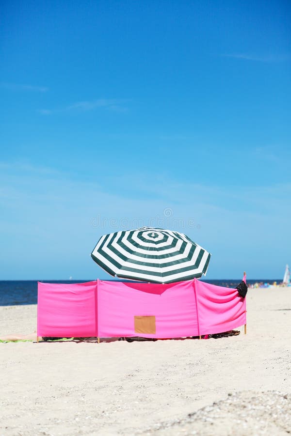 Wind Shelter and Parasol on the Beach Stock Image - Image of coast ...