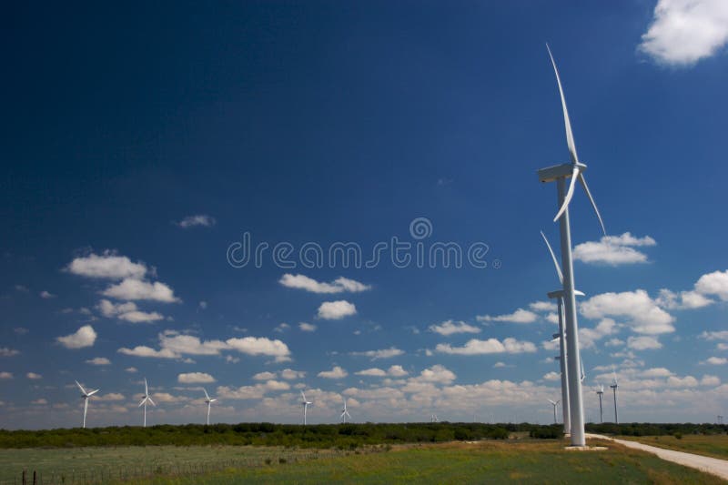 Wind turbines at sunset stock photo. Image of clouds, alternative - 1894188