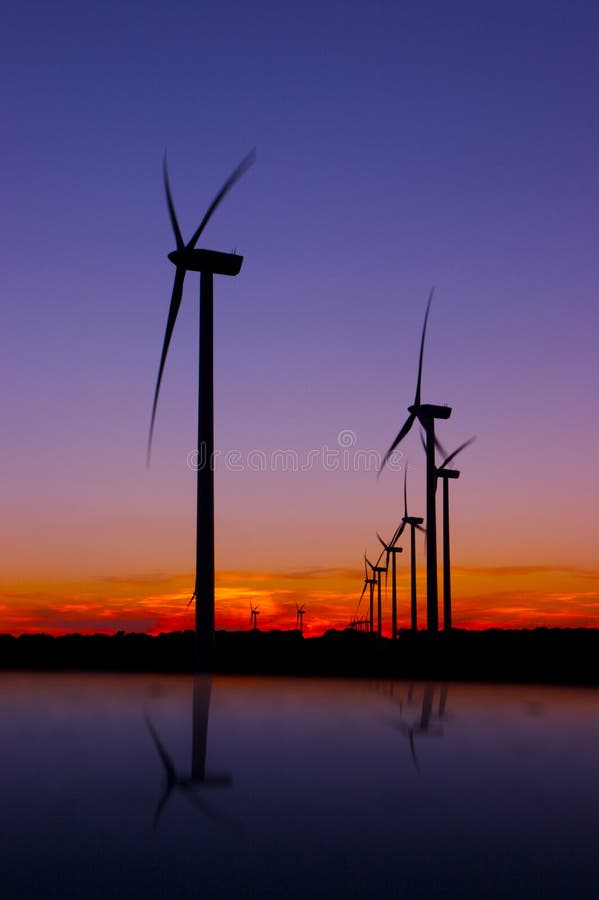 WIND TURBINES at SUNSET stock photo. Image of clouds, alternative - 1894188