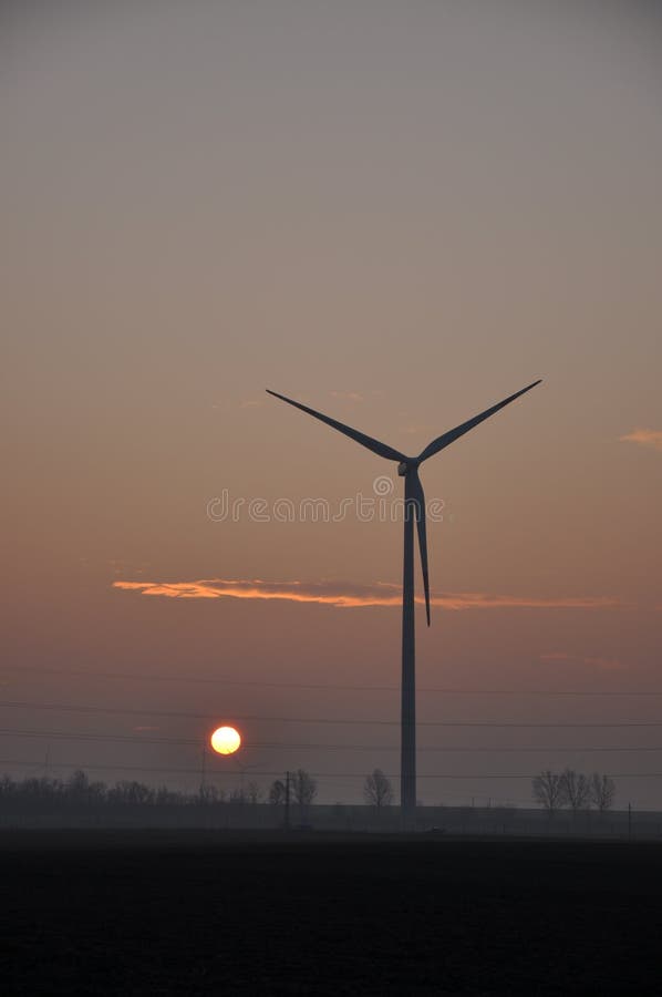 Wind tubine at sunset stock photo. Image of electrical - 12893988