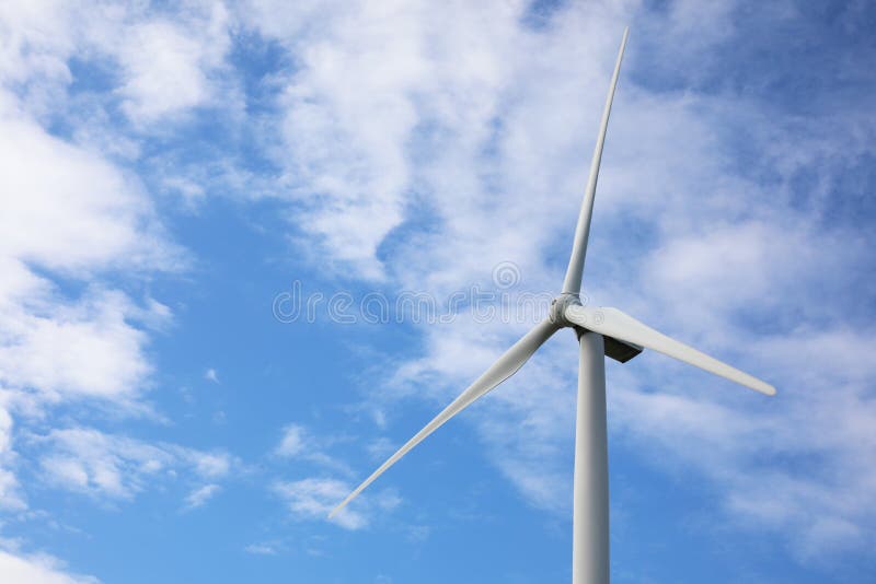 Wind Turbine Against Beautiful Blue Sky. Alternative Energy Source ...