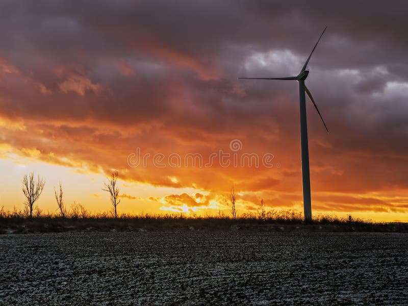 Wind Turbine Against a Beautiful Sunset Background Stock Photo - Image ...