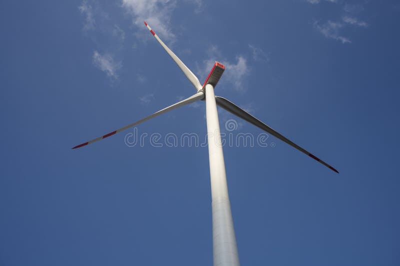 A Wind Turbine with a Blue Sky and Clouds Stock Photo - Image of wind ...