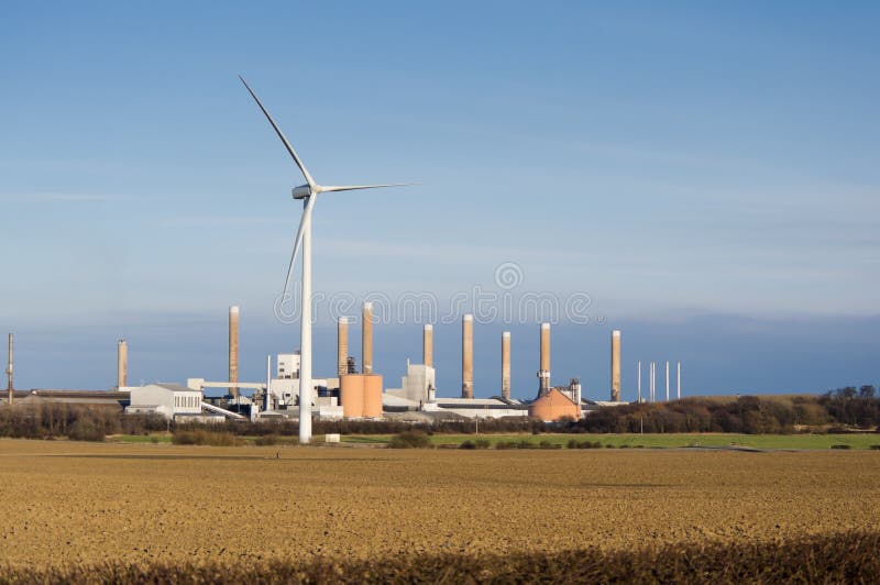 Wind turbine and factory stock photo. Image of rotate - 23969002