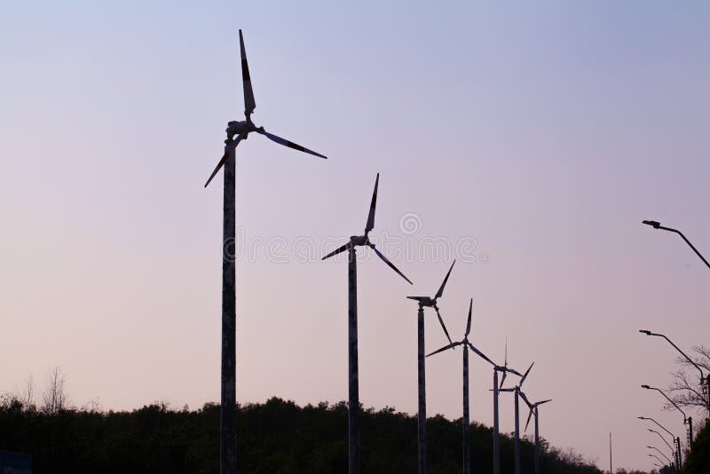 Wind Turbine Farm with Rays of Light at Sunset Stock Image - Image of ...