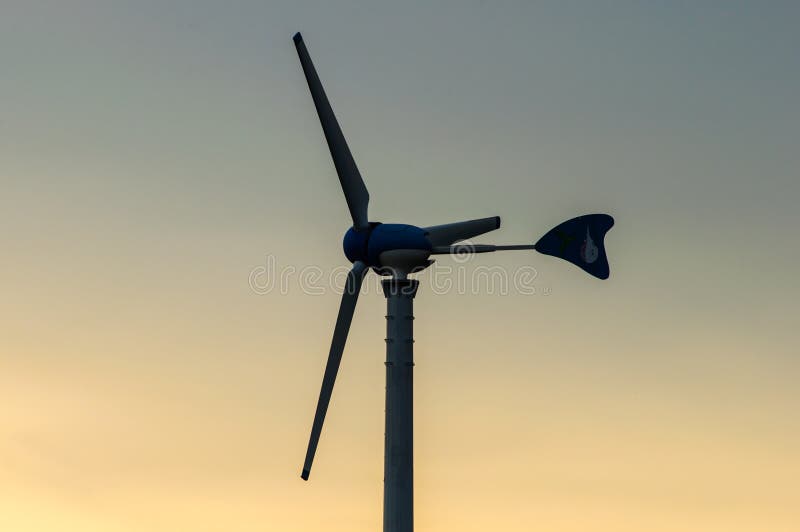 Wind Turbine Farm with Rays of Light at Sunset Stock Photo - Image of ...