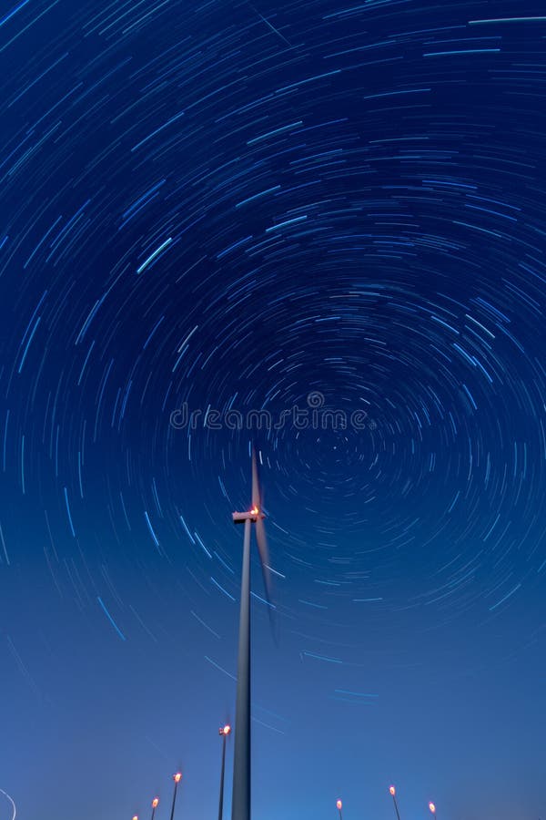 Wind Turbine Farm and Startrails at Night Stock Image - Image of ...