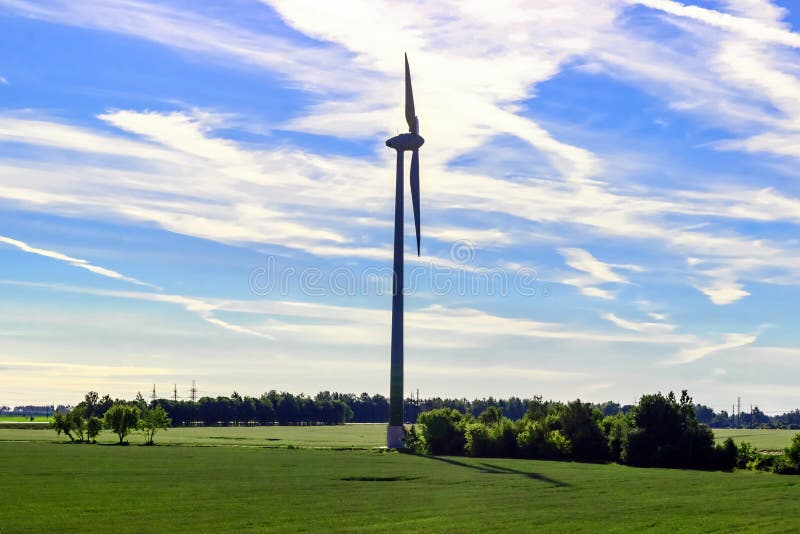 Wind Turbine in the Field. Wind Generator. Blue Sky. Stock Photo ...