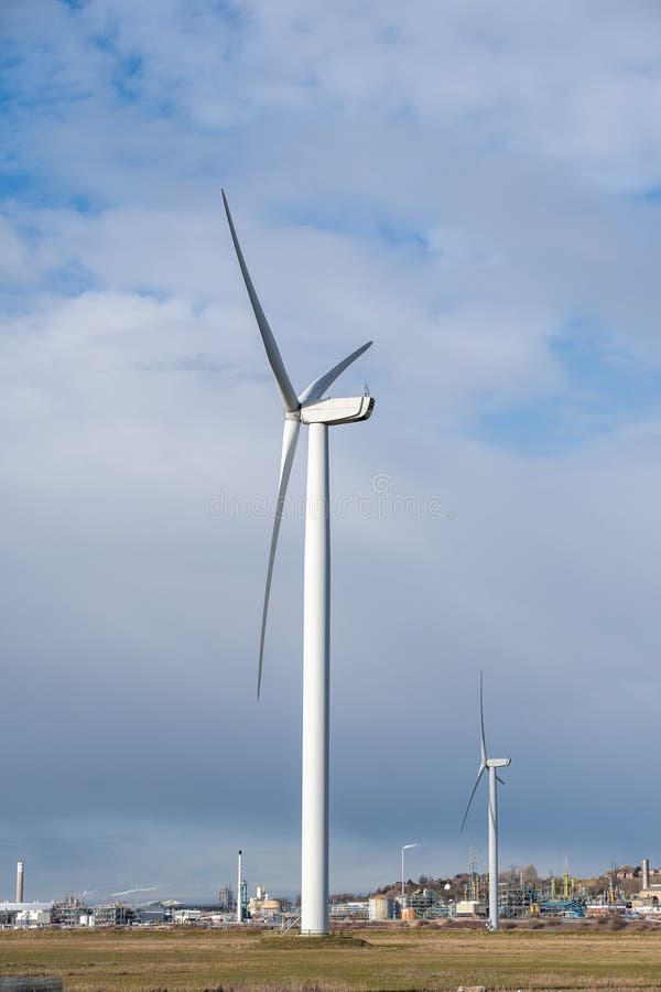 Wind turbine in a field stock photo. Image of generate - 213038156