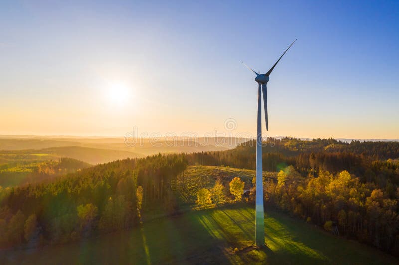 Wind Turbine in the Forest in the Evening Sun Stock Photo - Image of ...