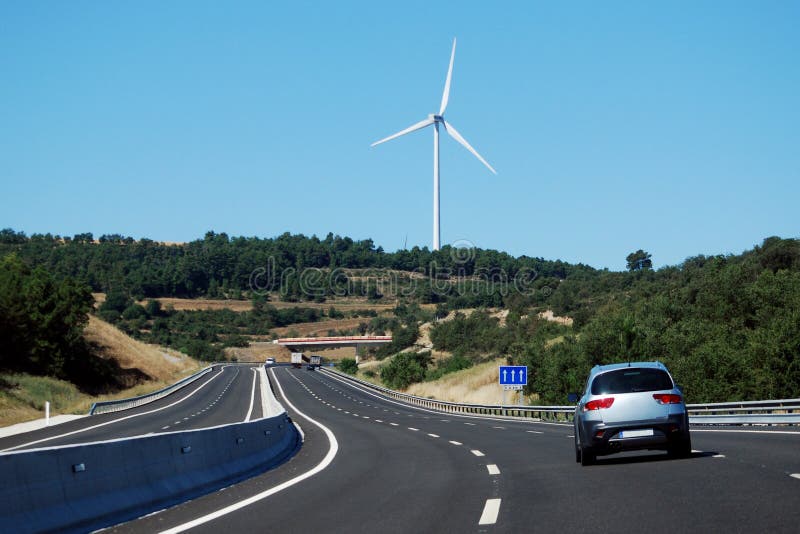 Wind turbine and highway stock photo. Image of road, trucks - 18896554