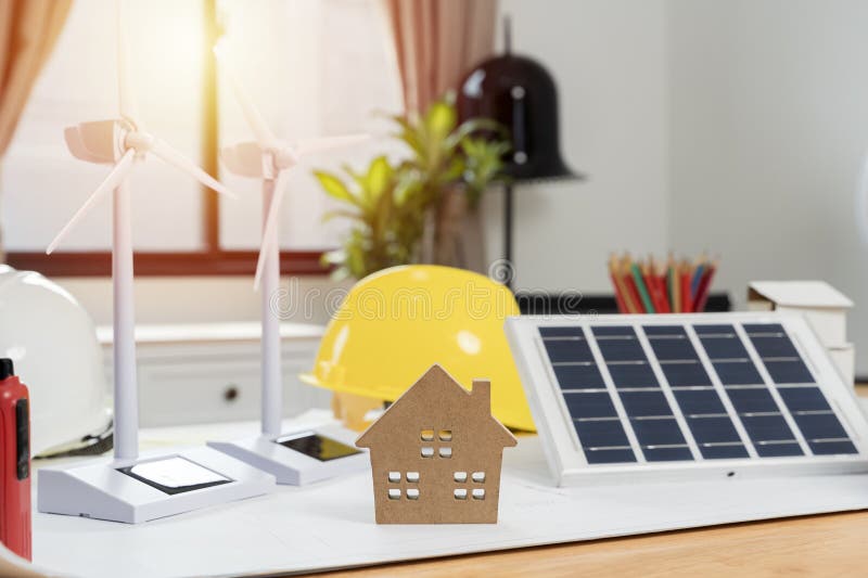 Wind Turbine Model, Construction Plan and Laptop on Table in Office, Solar Panel at Home Stock ...